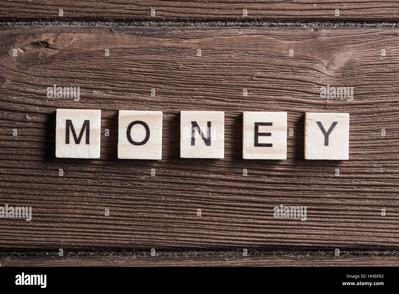 wooden elements with letter collected word money Stock Photo - Alamy