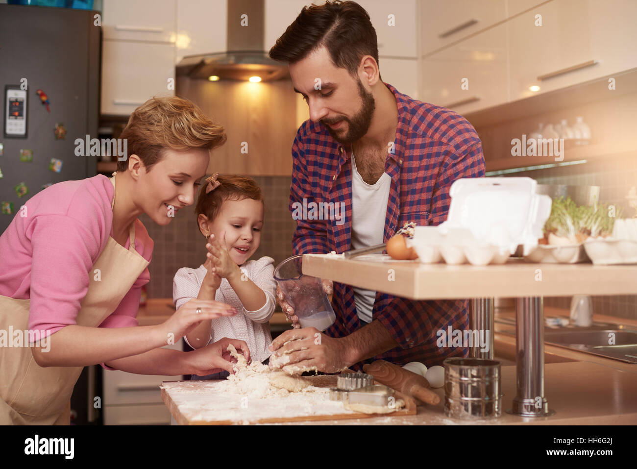 Little daughter as a very good helper Stock Photo - Alamy