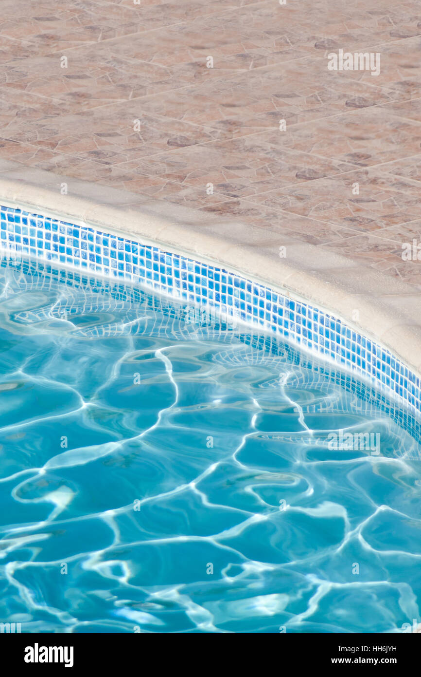 part of the swimming pool with blue water Stock Photo - Alamy