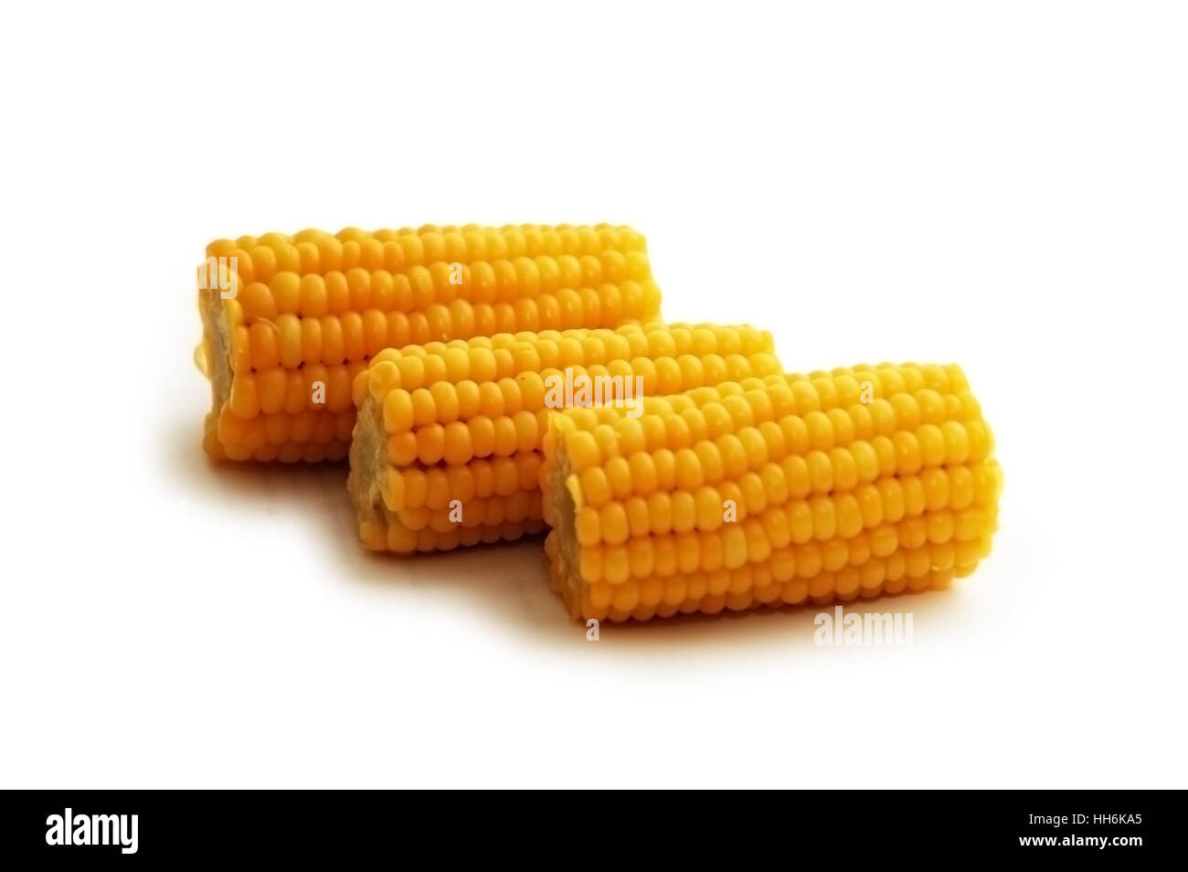 Three corn cobs isolated on white background Stock Photo - Alamy
