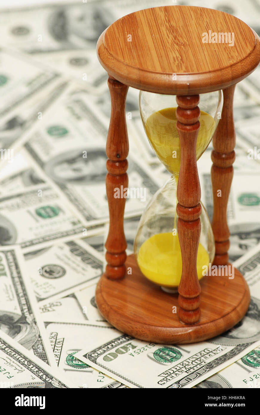 "Time is money" with dollar notes and hourglass Stock Photo - Alamy