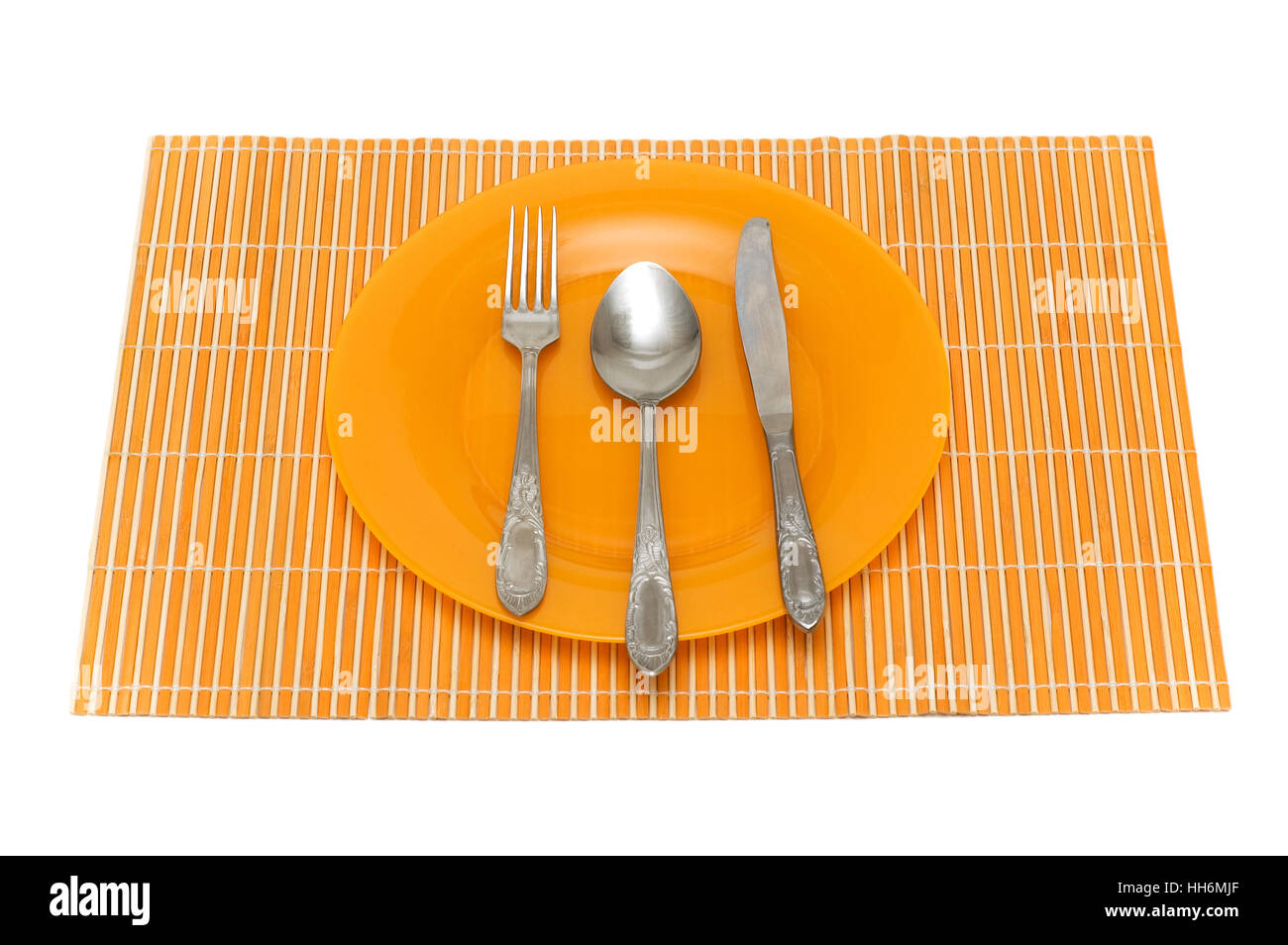 Set of table utensils in the plate isolated on white Stock Photo - Alamy