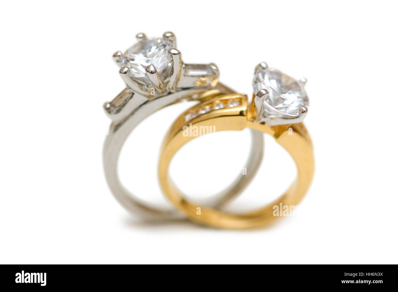 Two wedding diamond rings isolated on white Stock Photo - Alamy
