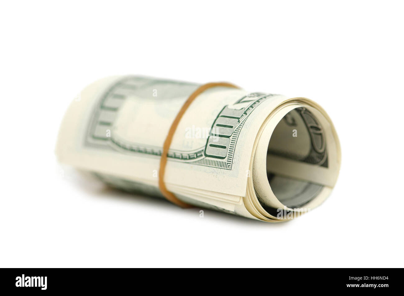 American dollars rolled up isolated on the white Stock Photo - Alamy