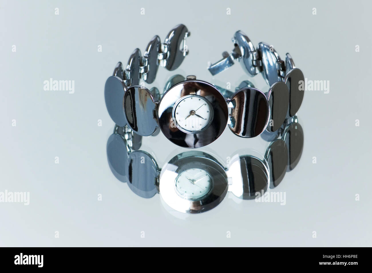 Stylish hand watch on the reflective background Stock Photo - Alamy