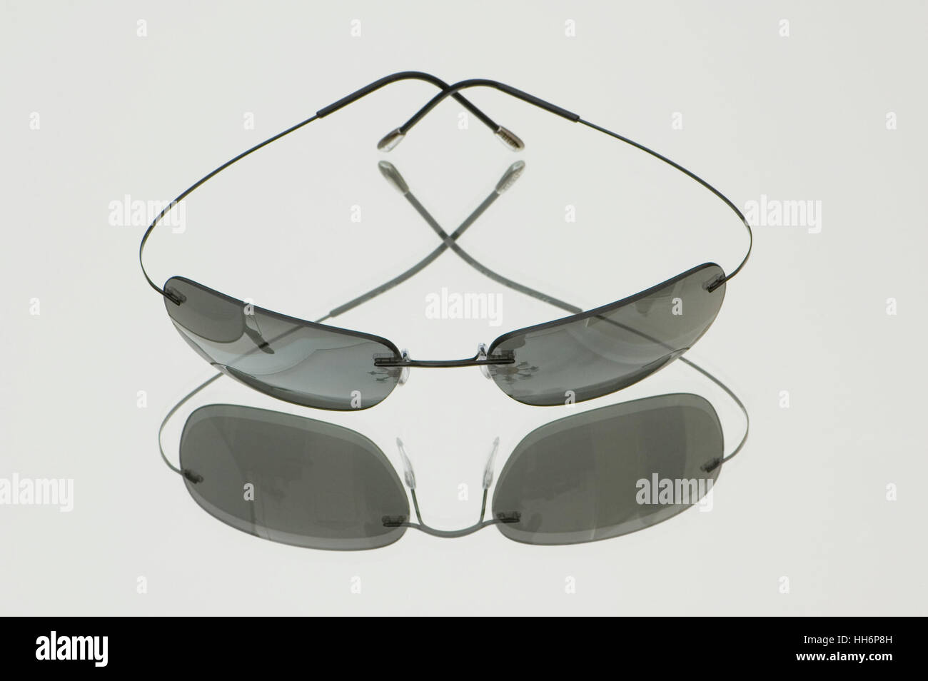 Stylish sun glasses on highly reflective background Stock Photo - Alamy