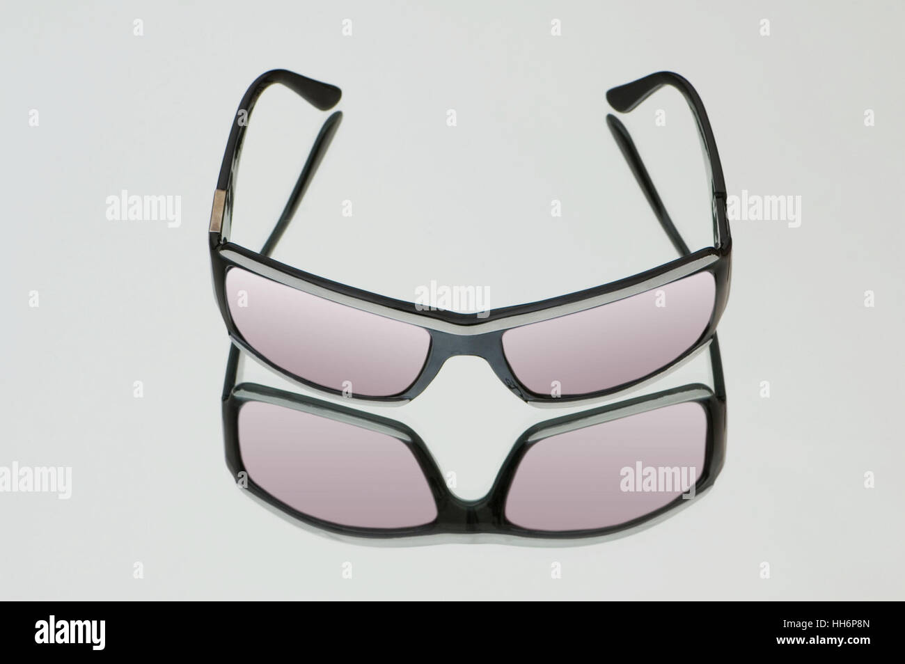 Stylish sun glasses on highly reflective background Stock Photo - Alamy