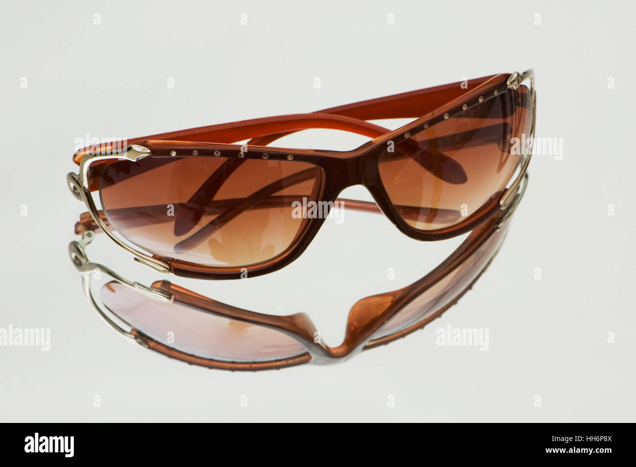 Stylish sun glasses on highly reflective background Stock Photo - Alamy