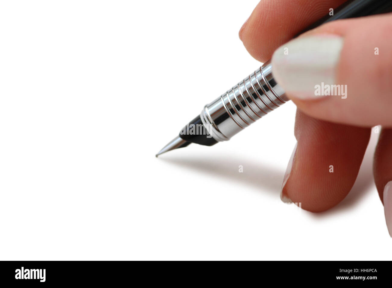 Hand holding pen isolated on white background Stock Photo - Alamy