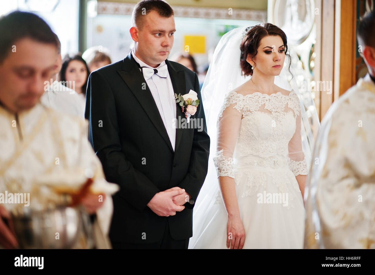 Wedding couple indoor at church enter gate to wedding ceremony Stock ...