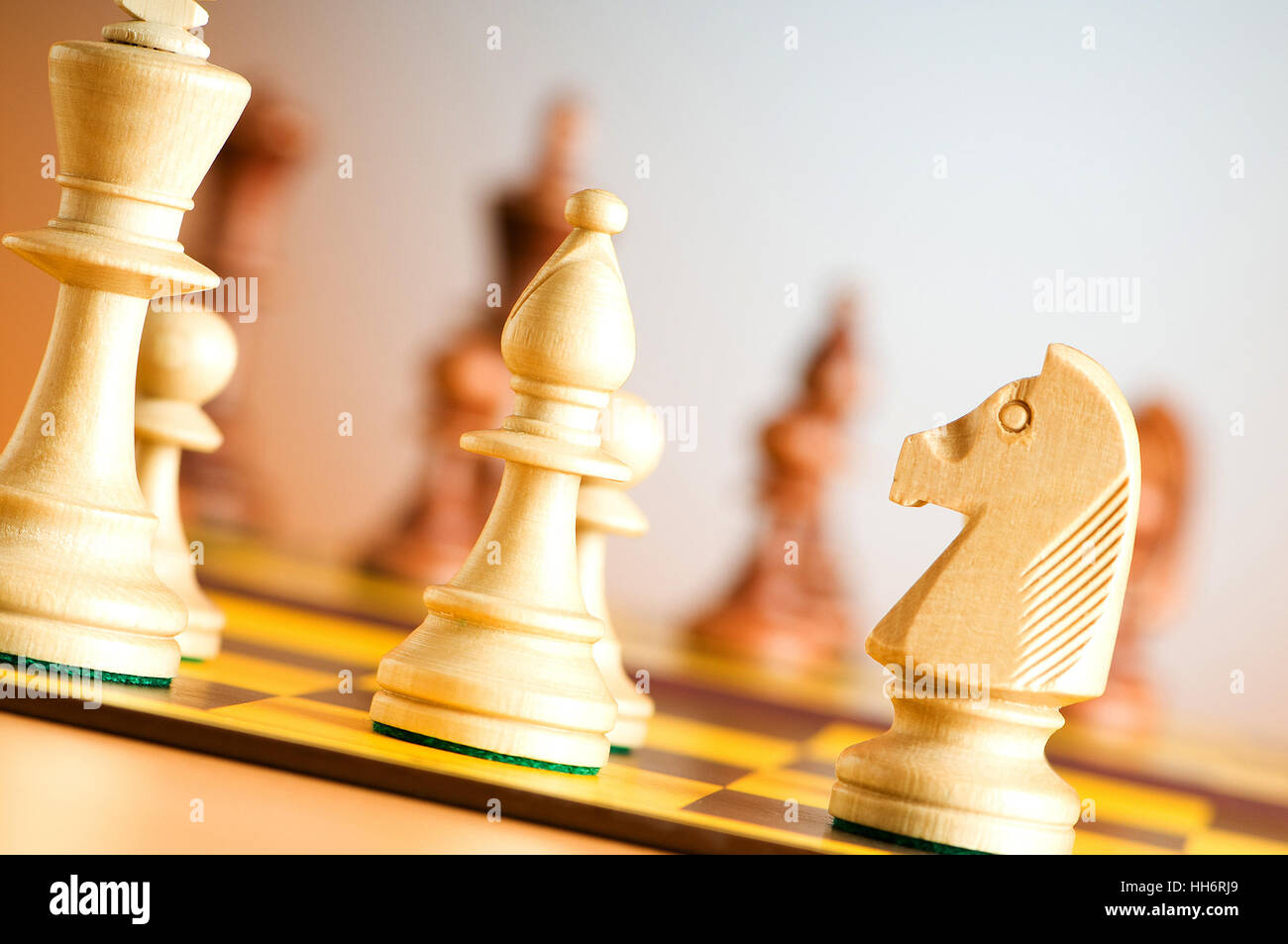 Set of chess figures on the playing board Stock Photo - Alamy
