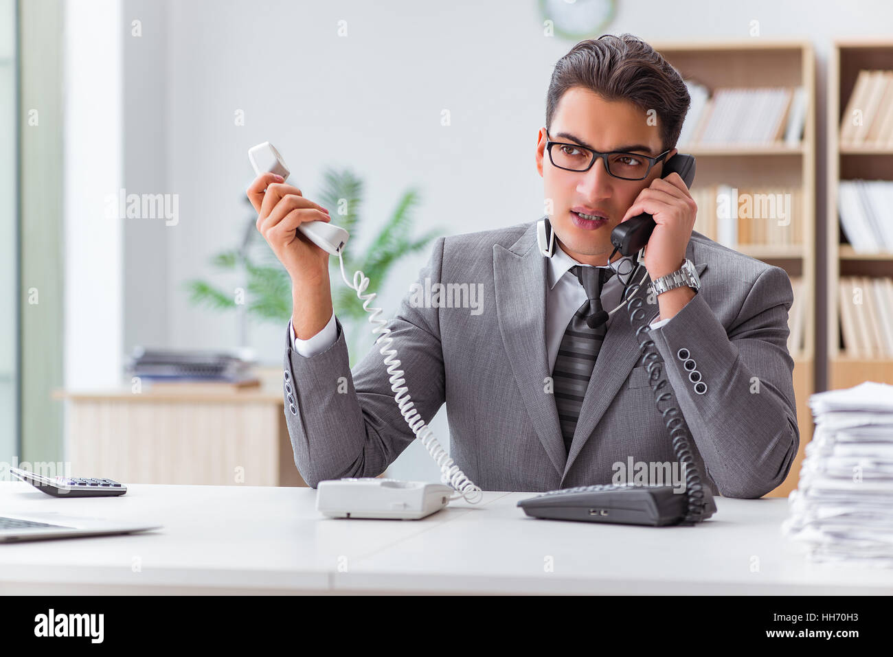 Angry helpdesk operator in the office Stock Photo - Alamy