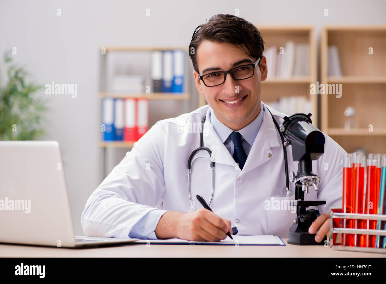 Man doctor working in the lab Stock Photo - Alamy