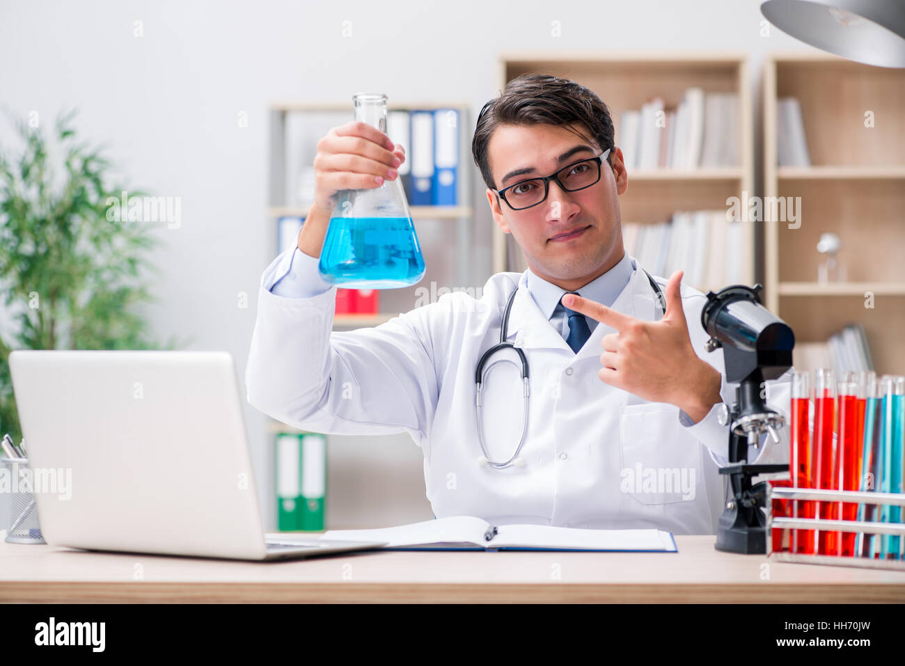 Man doctor working in the lab Stock Photo - Alamy