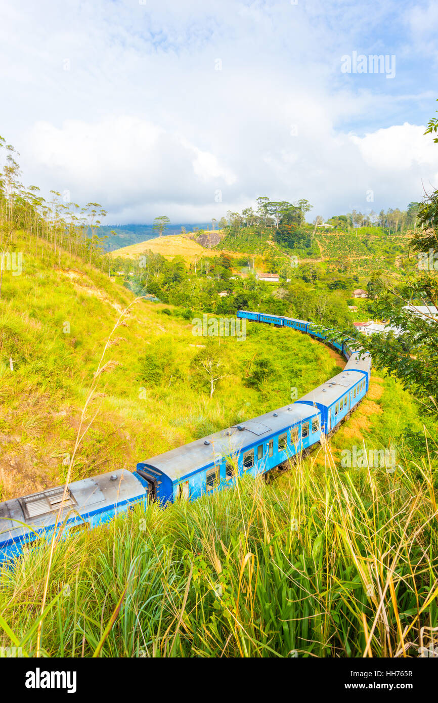 Passenger train moving away on unique circular curving portion of ...