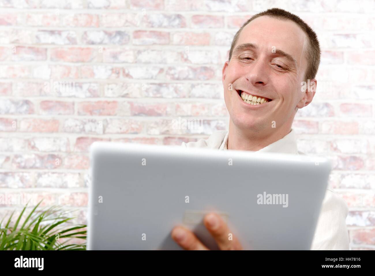 an handsome man using tablet computer Stock Photo - Alamy