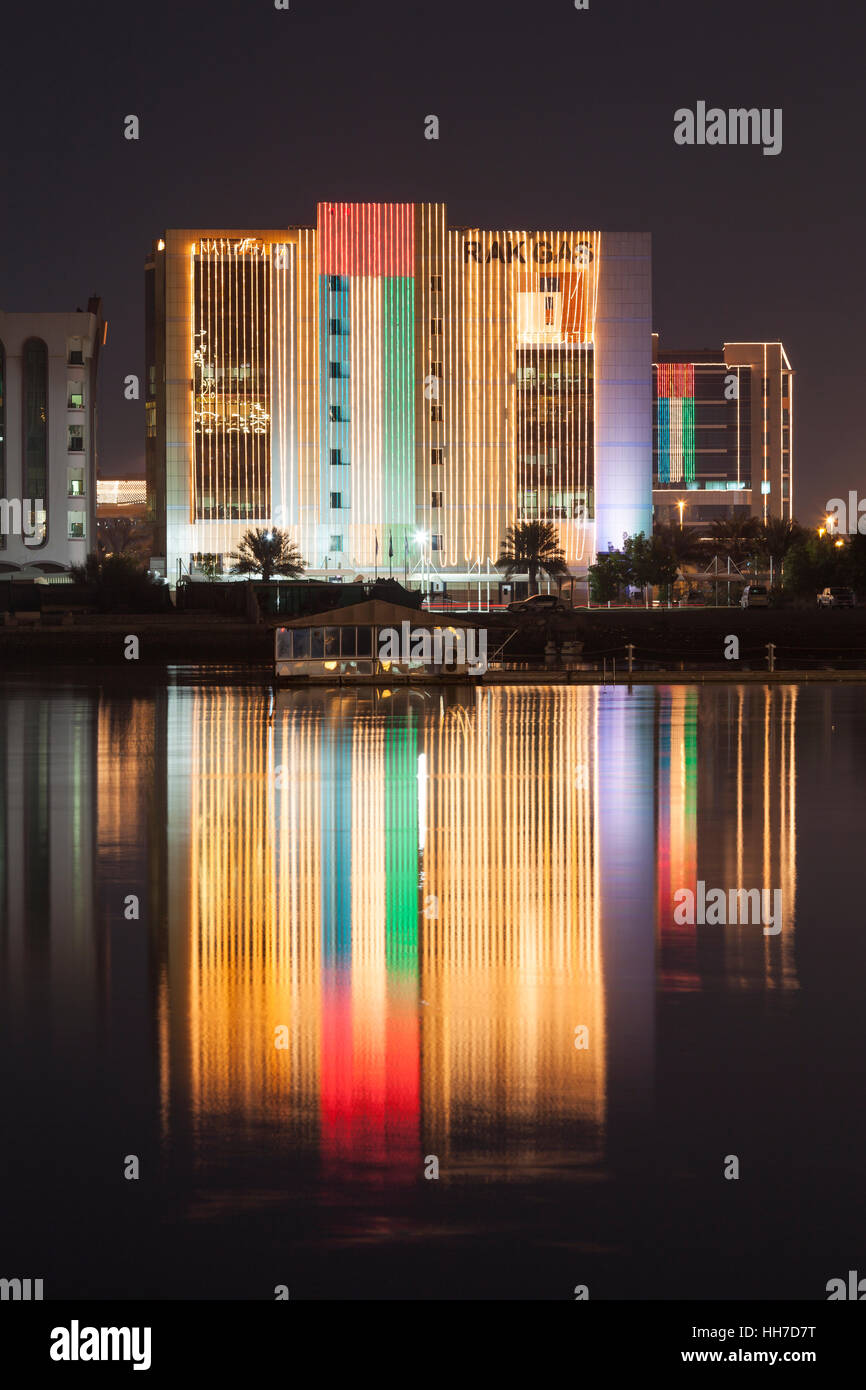 Headquarters of the RAK GAS illuminated at night, Ras al Khaimah, UAE ...