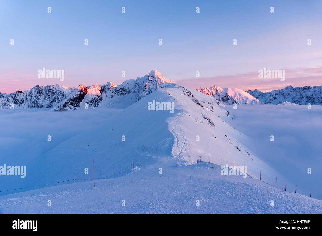 Big mountain peaks at sunset and inversion Stock Photo - Alamy