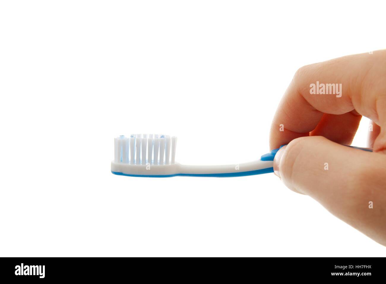 Toothbrush in a human hand isolated on white Stock Photo - Alamy