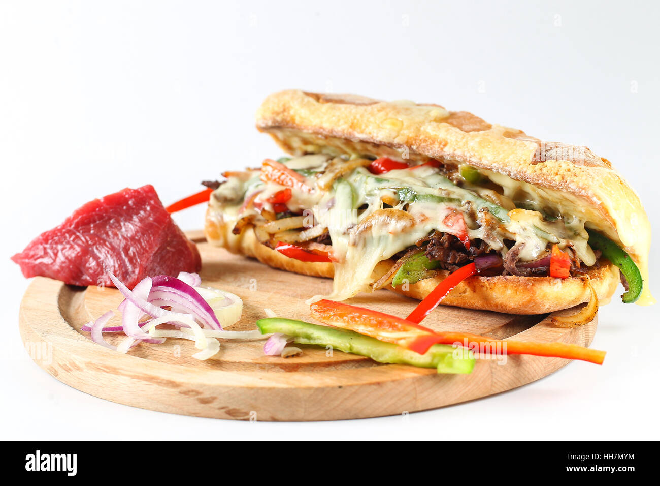 Tasty beef steak sandwich with onions, mushroom and melted provolone ...