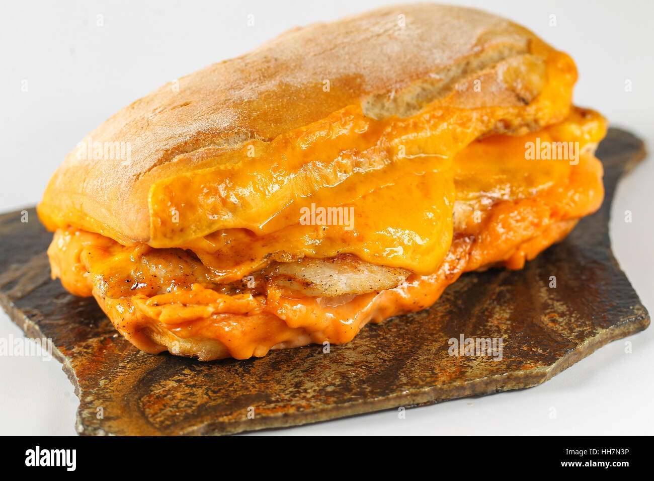 Tasty chicken steak sandwich in a ciabatta with cheddar cheese and ...