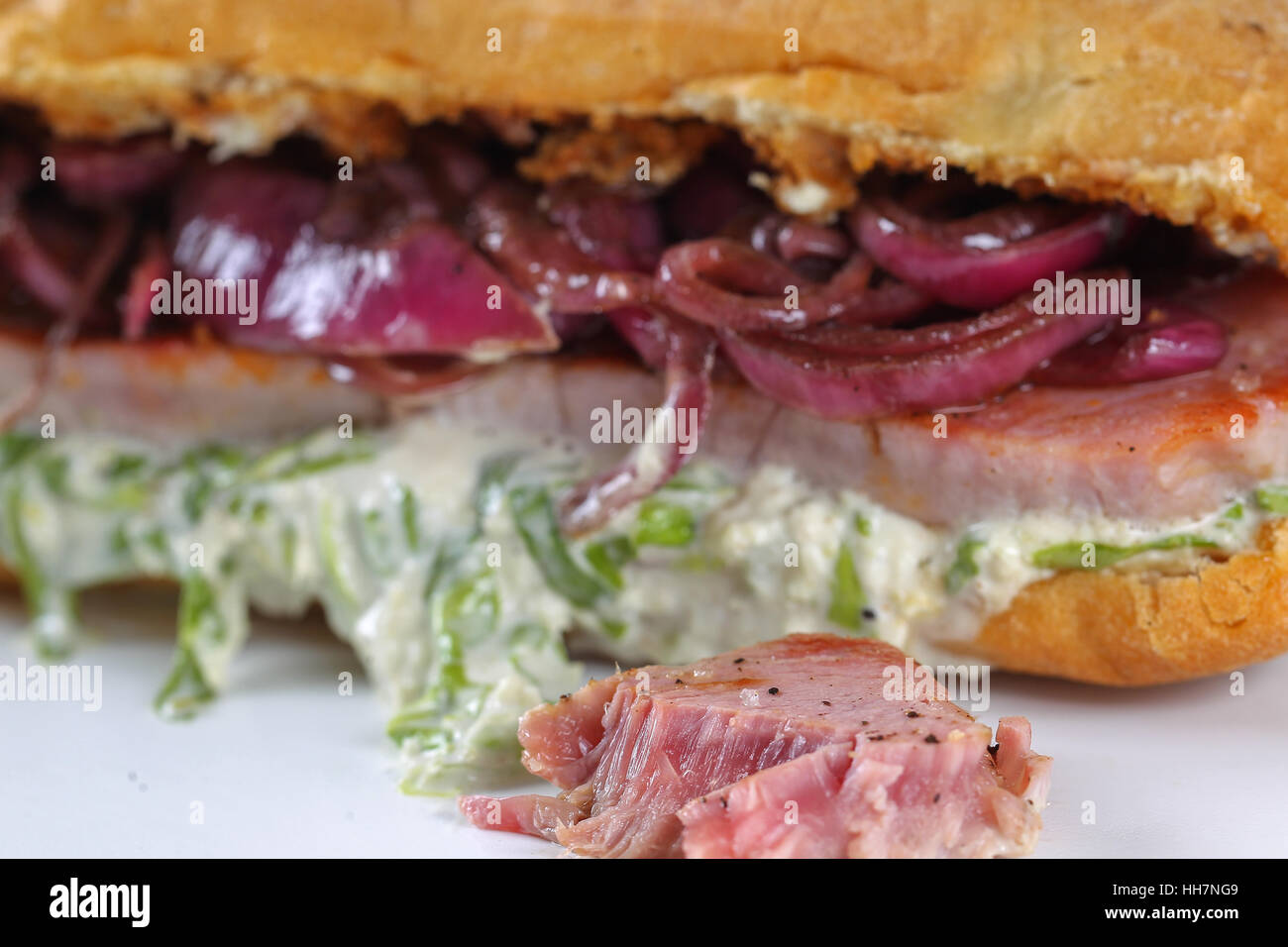 Tasty tuna steak sandwich in a ciabatta with lettuce, onions, Marie ...