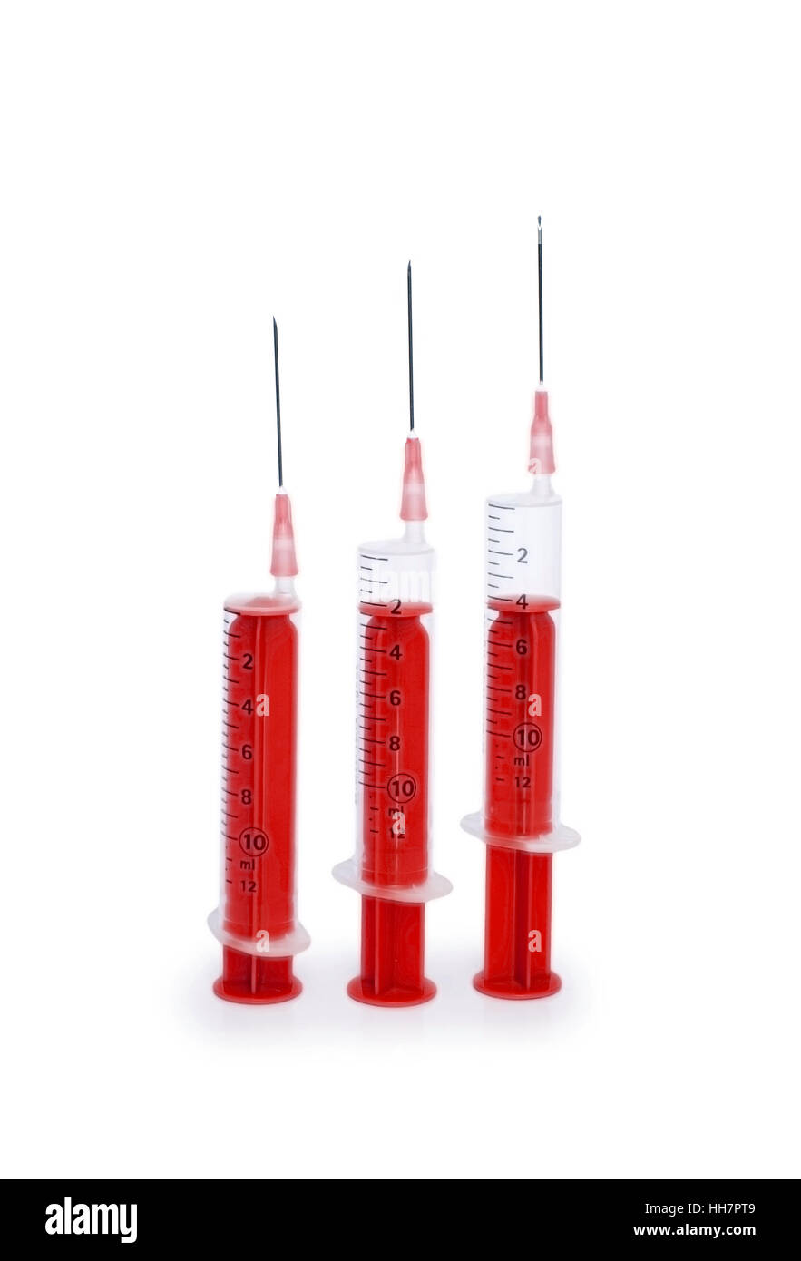 Three syringes isolated on the white background Stock Photo - Alamy