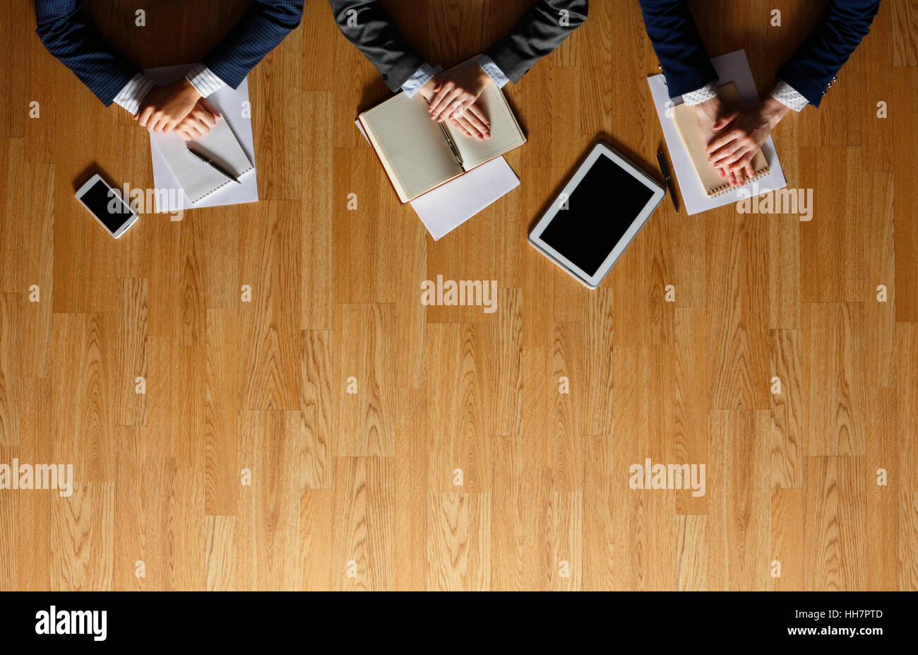 Top view of business people sitting at table and having meeting Stock ...