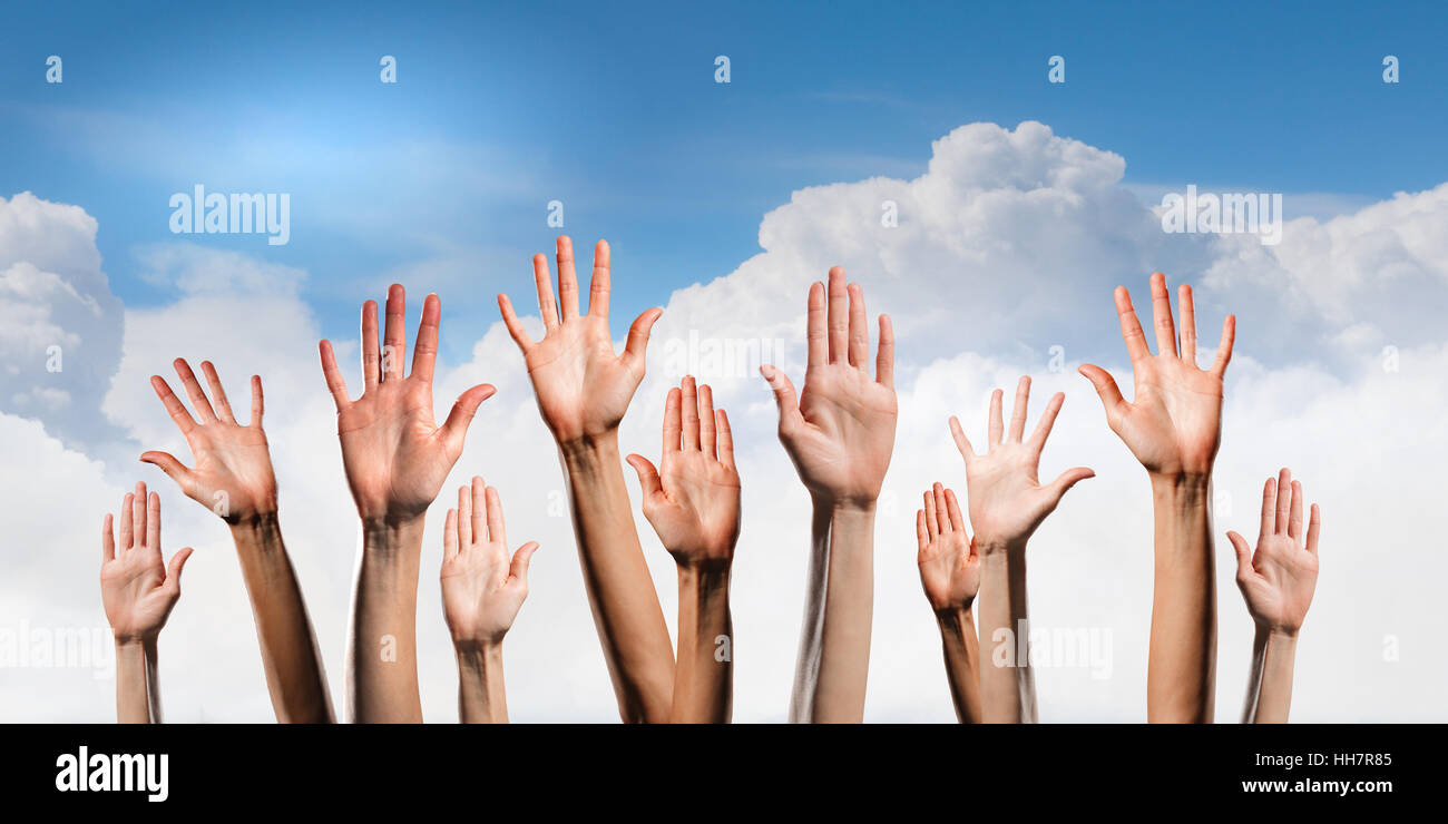 Row of raised hands showing different gestures Stock Photo - Alamy