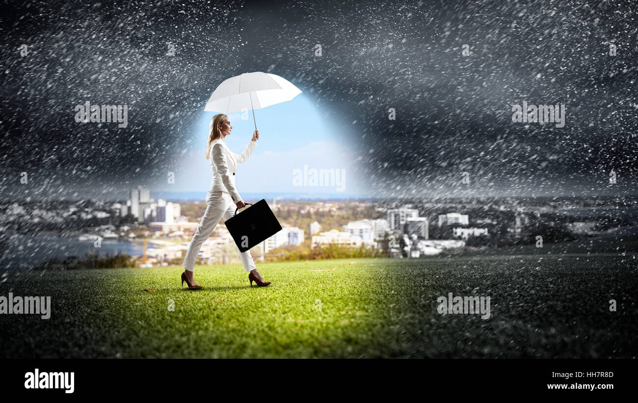 Hidden under umbrella hi-res stock photography and images - Alamy