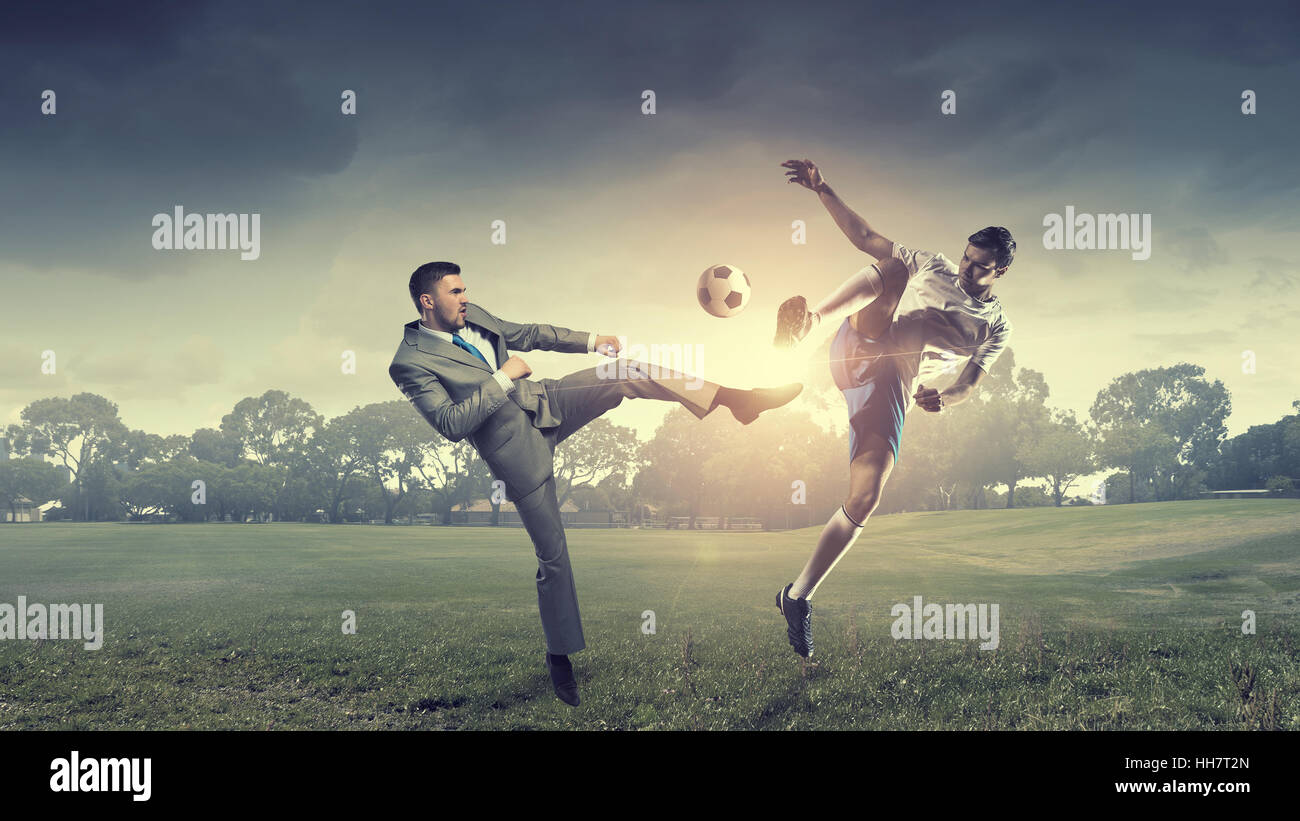 Football player with ball in action outdoors Stock Photo - Alamy