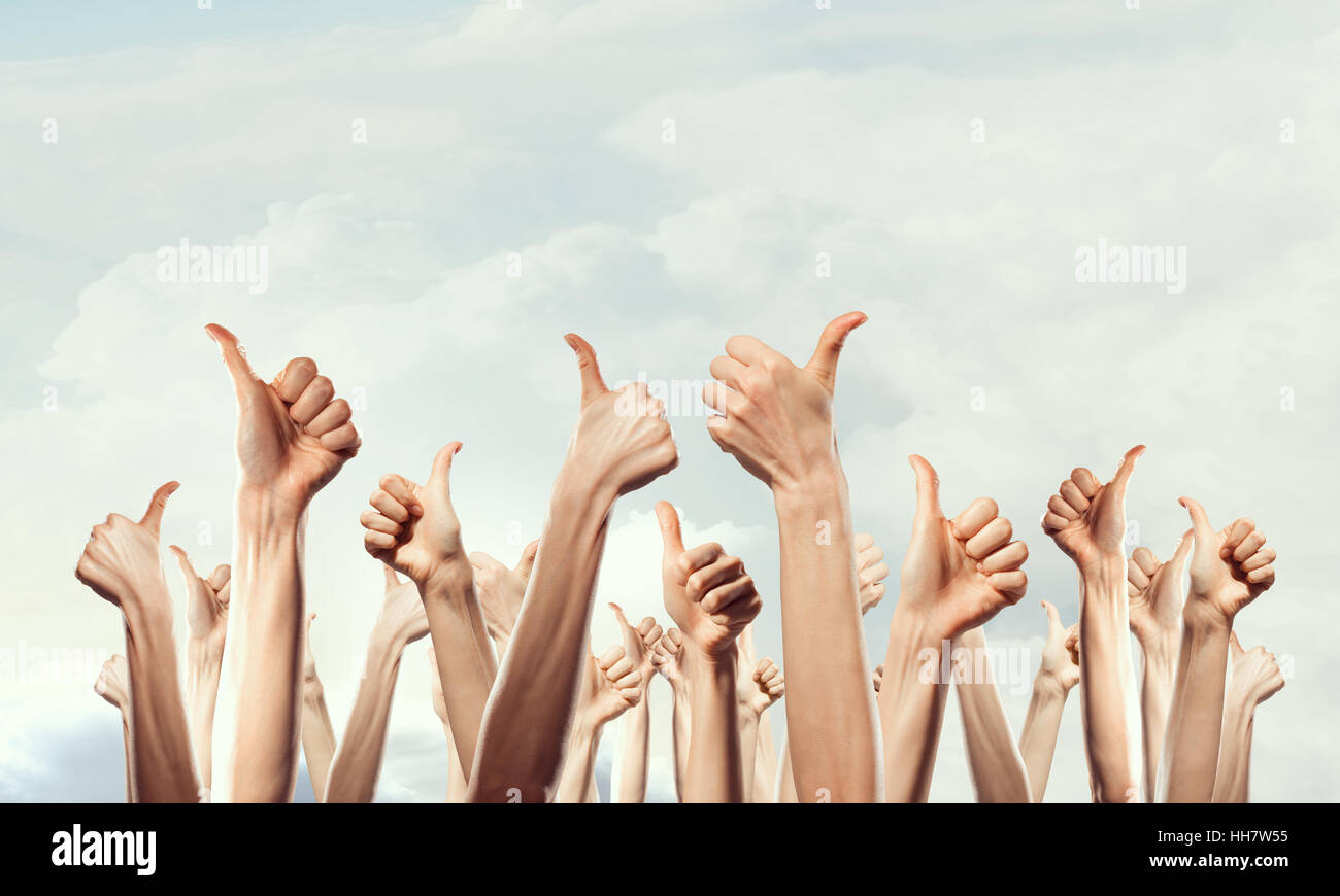 Row of raised hands showing different gestures Stock Photo - Alamy