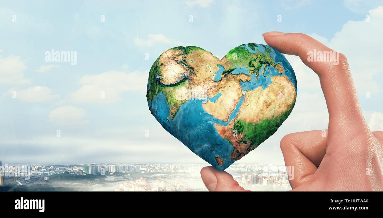 Small Earth planet ball between female fingers. Elements of this image ...