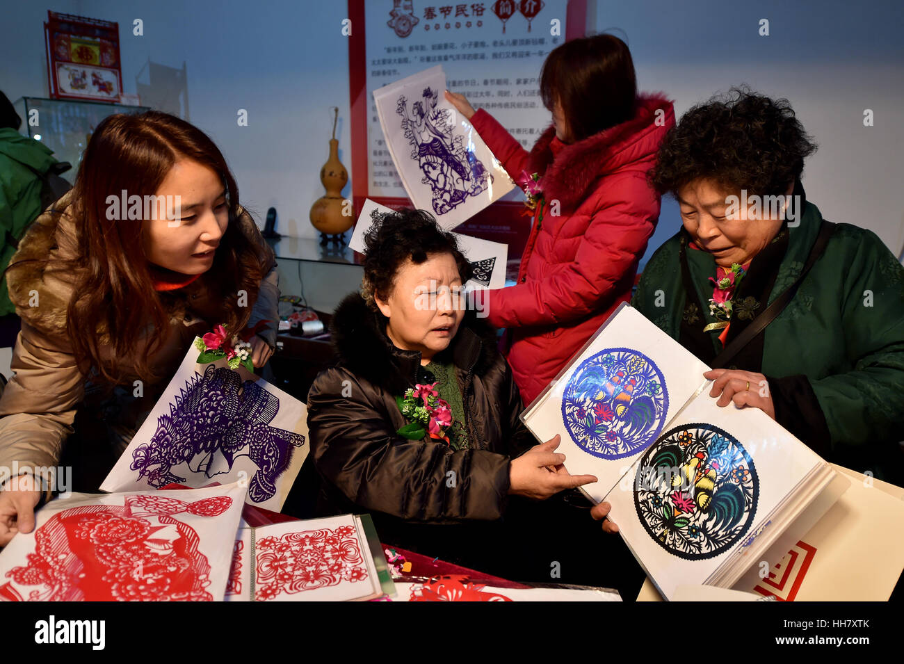 Beijing, China. 17th Jan, 2017. Chinese paper-cutting master Zhou ...