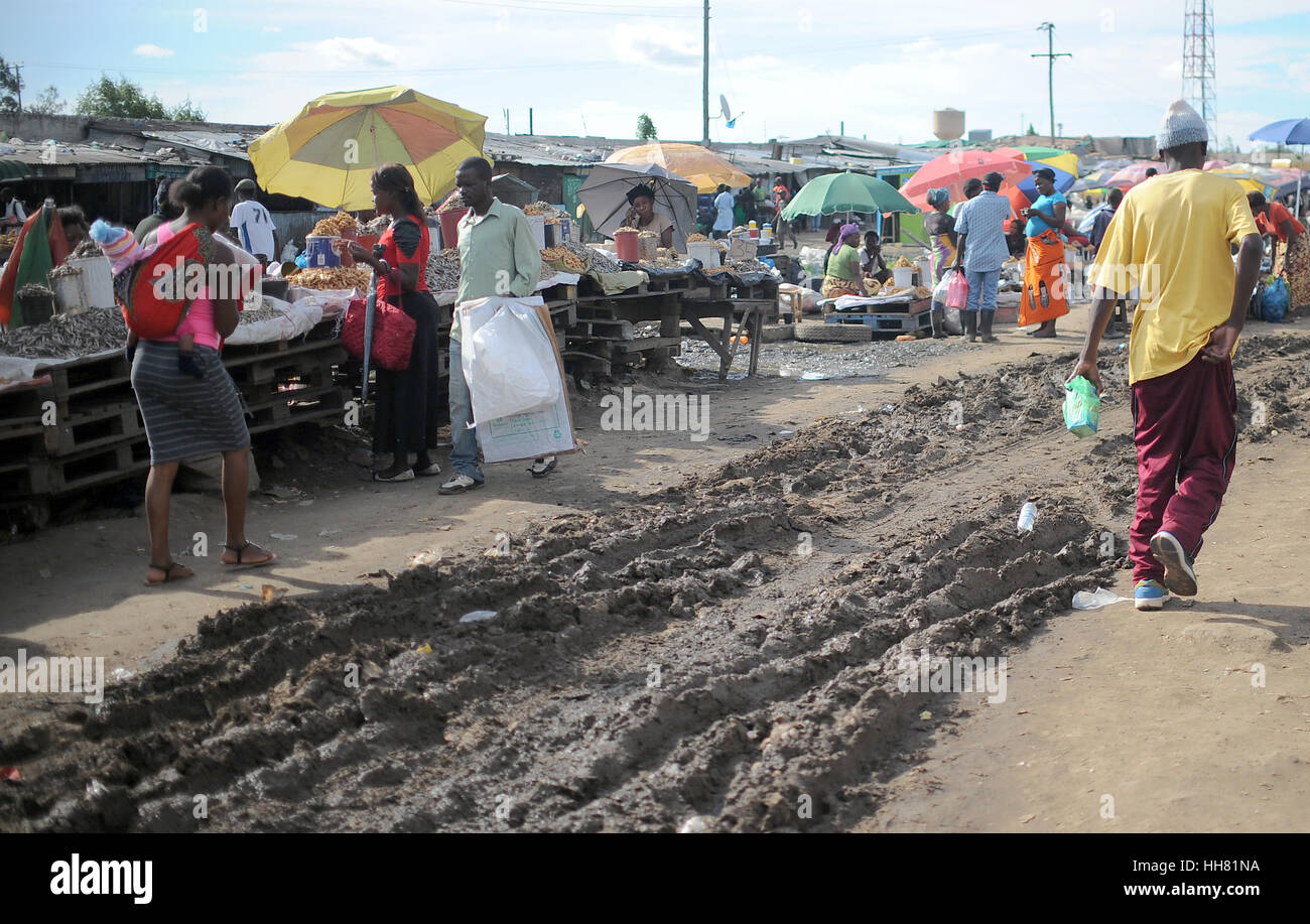 Muddy paths lead through the Soweto market in Lusaka, Zambia, 11 March ...
