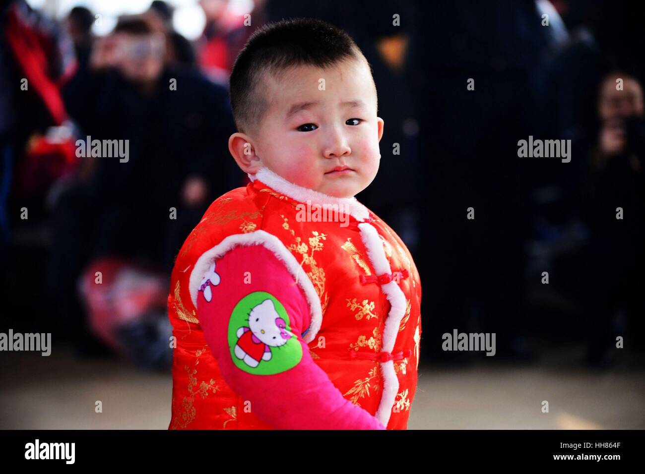 Jiaozh, China. 18th Jan, 2017. A cute kid wearing Chinese traditional ...
