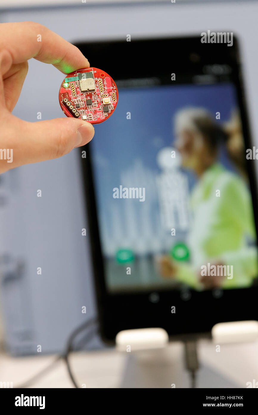 Tokyo, Japan. 18th January, 2017. An exhibitor shows a wearable sensor ...