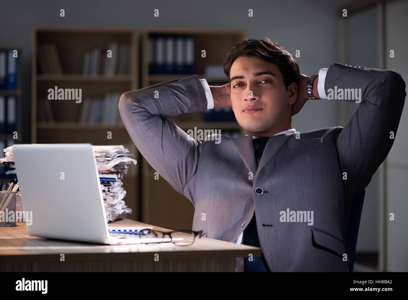 Man staying in the office for long hours Stock Photo - Alamy