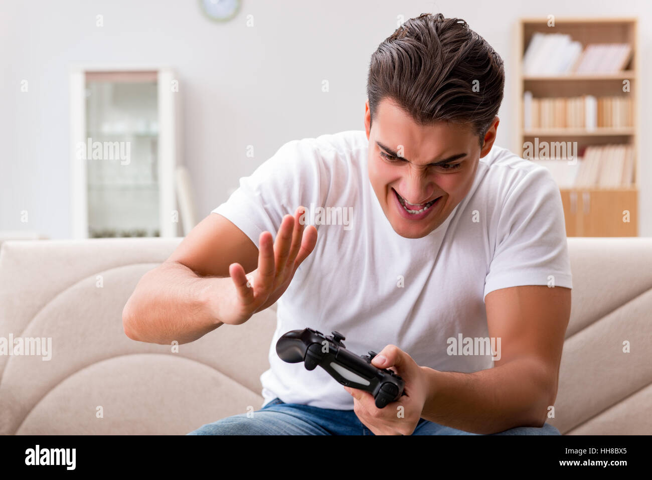 Man addicted to computer games Stock Photo - Alamy