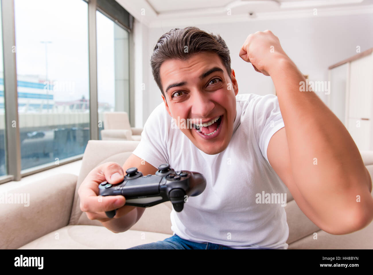Man addicted to computer games Stock Photo - Alamy