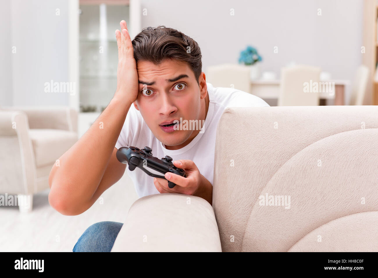 Man addicted to computer games Stock Photo - Alamy