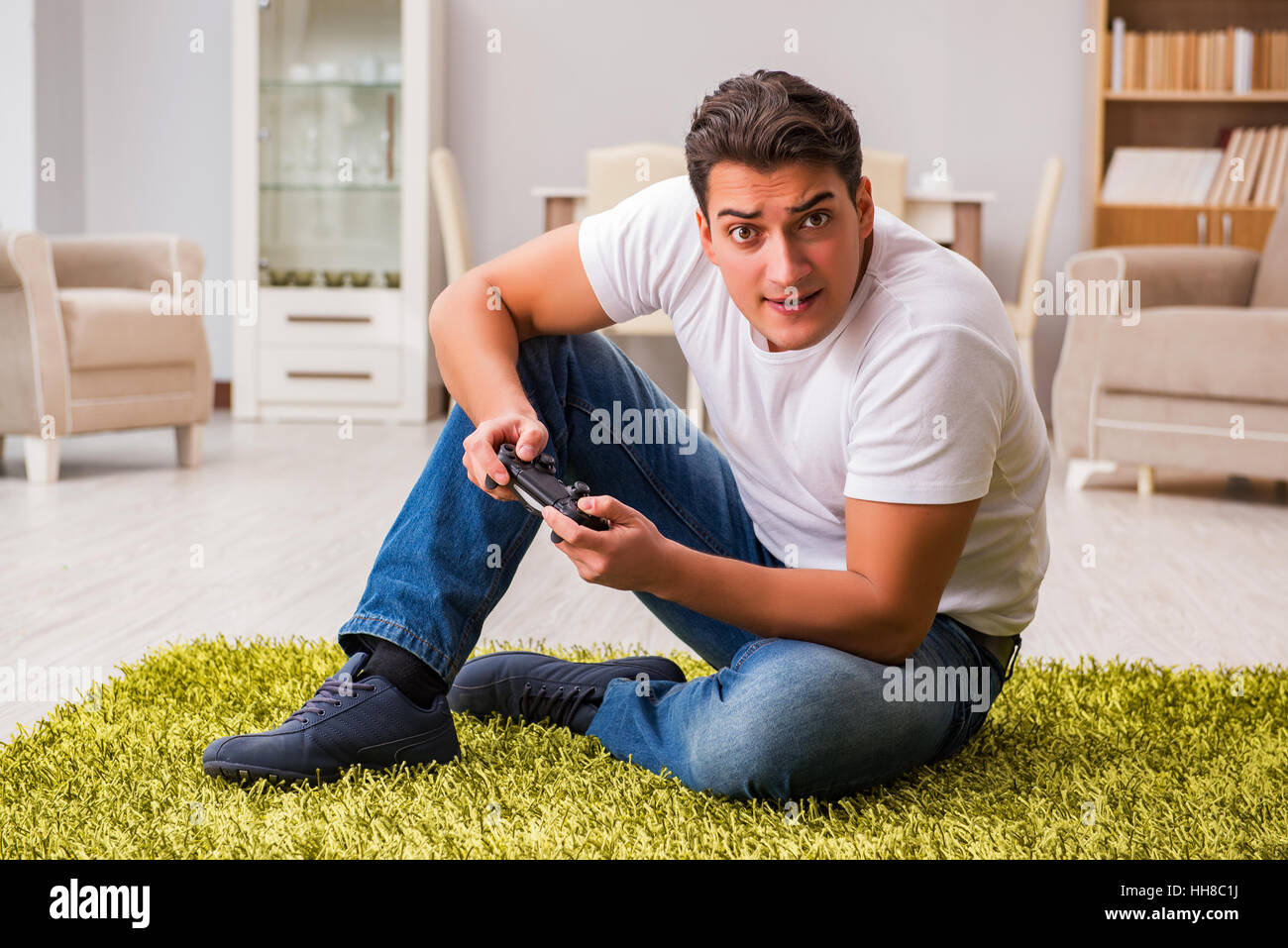 Man addicted to computer games Stock Photo - Alamy