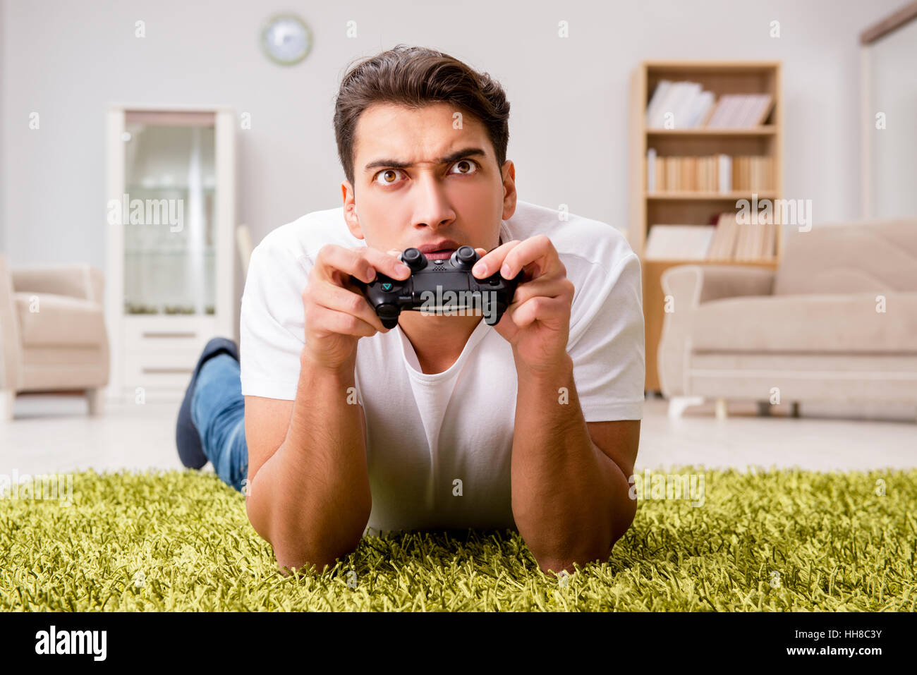 Man addicted to computer games Stock Photo - Alamy