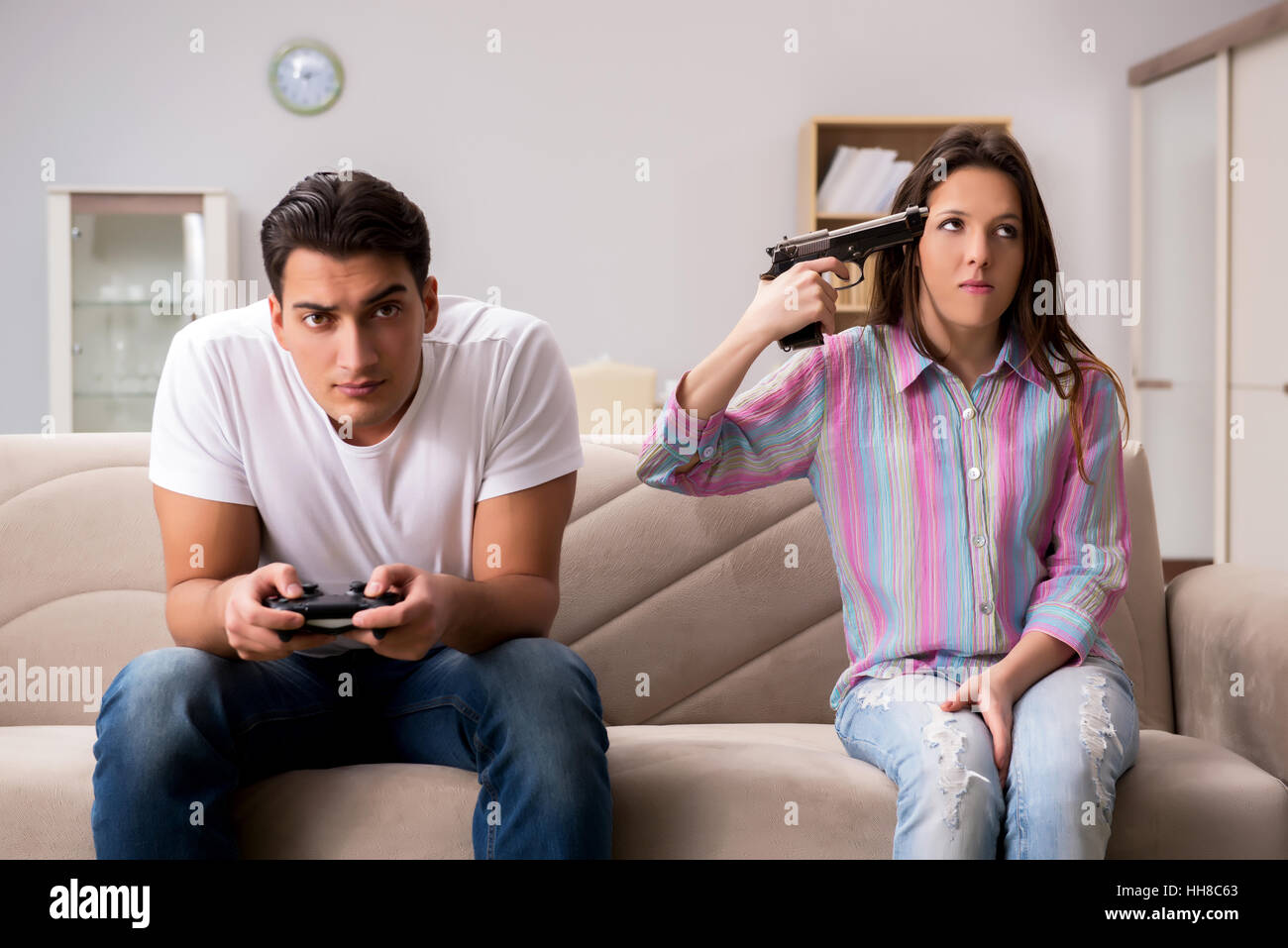 Young family suffering from computer games addiction Stock Photo - Alamy