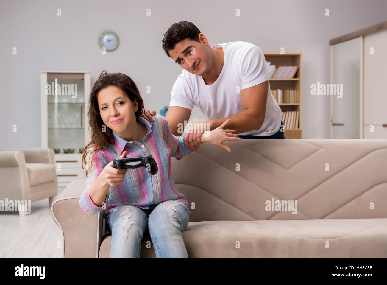 Young family suffering from computer games addiction Stock Photo - Alamy