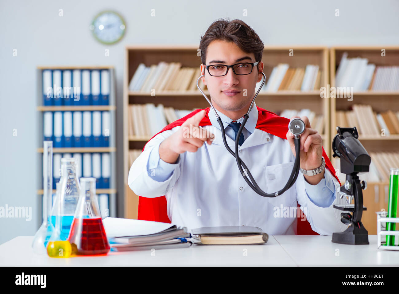 Superhero doctor working in the hospital lab Stock Photo - Alamy