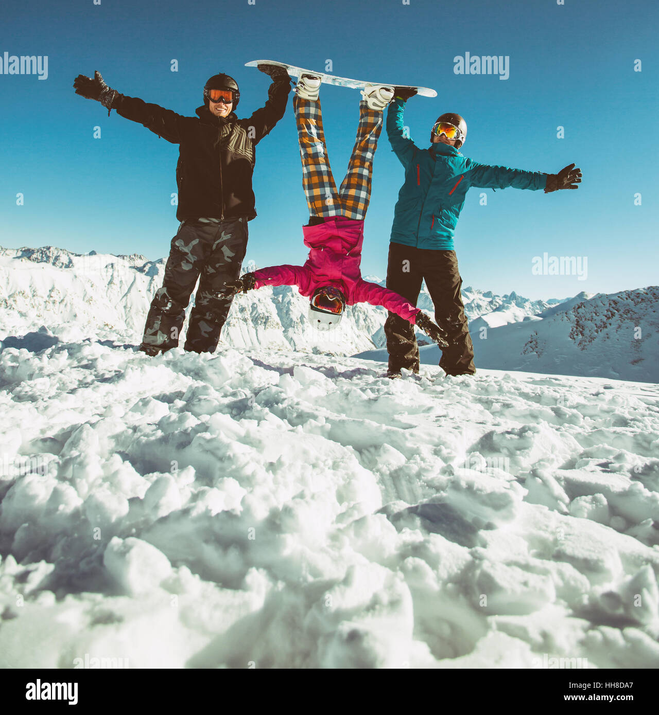 Group friends snowboarders have fun on the slope Stock Photo - Alamy