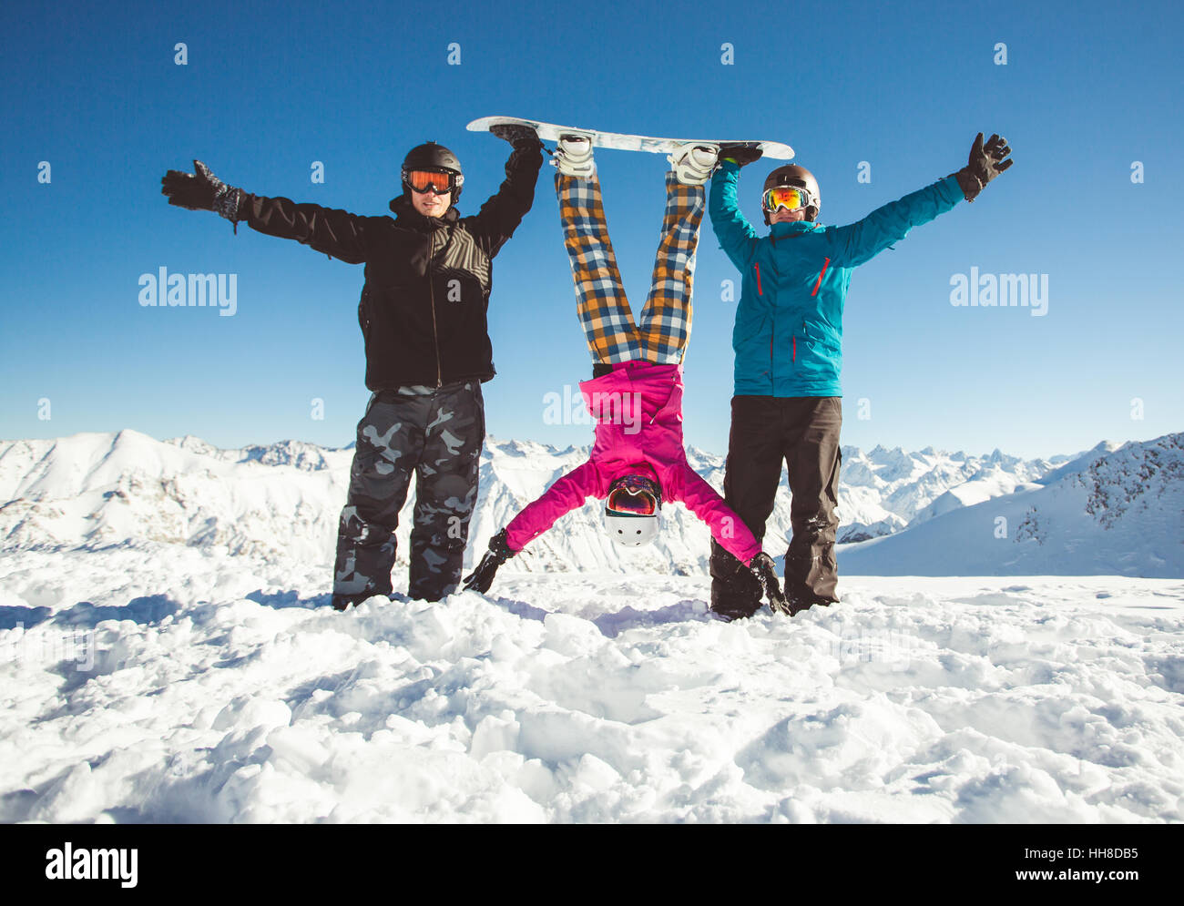 Group friends snowboarders have fun on the slope Stock Photo - Alamy