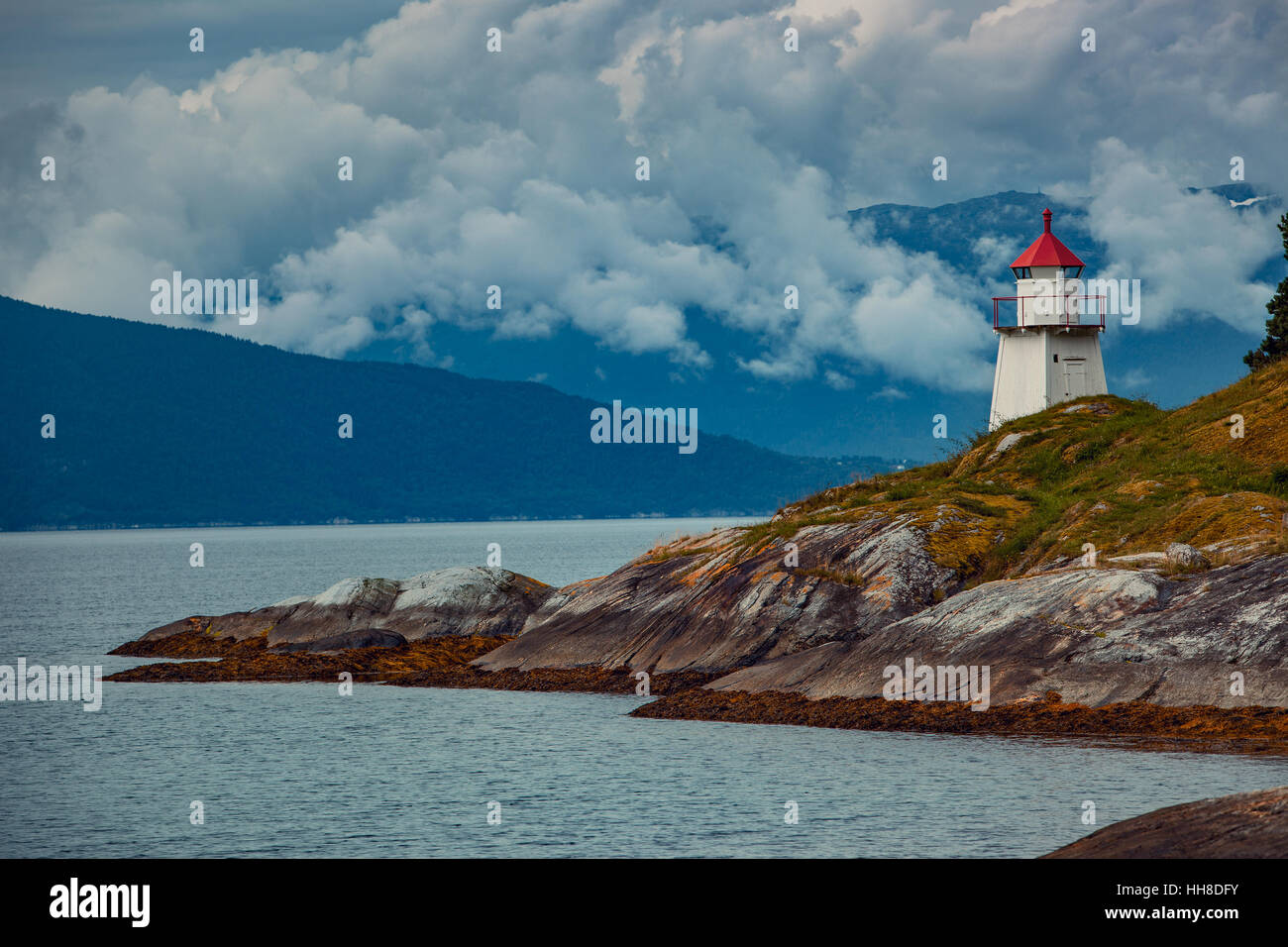 Lighthouse on fjord coast in Norway. Film style colors effect Stock ...