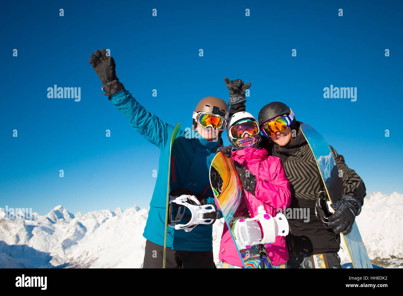 Group friends snowboarders have fun on the slope Stock Photo - Alamy
